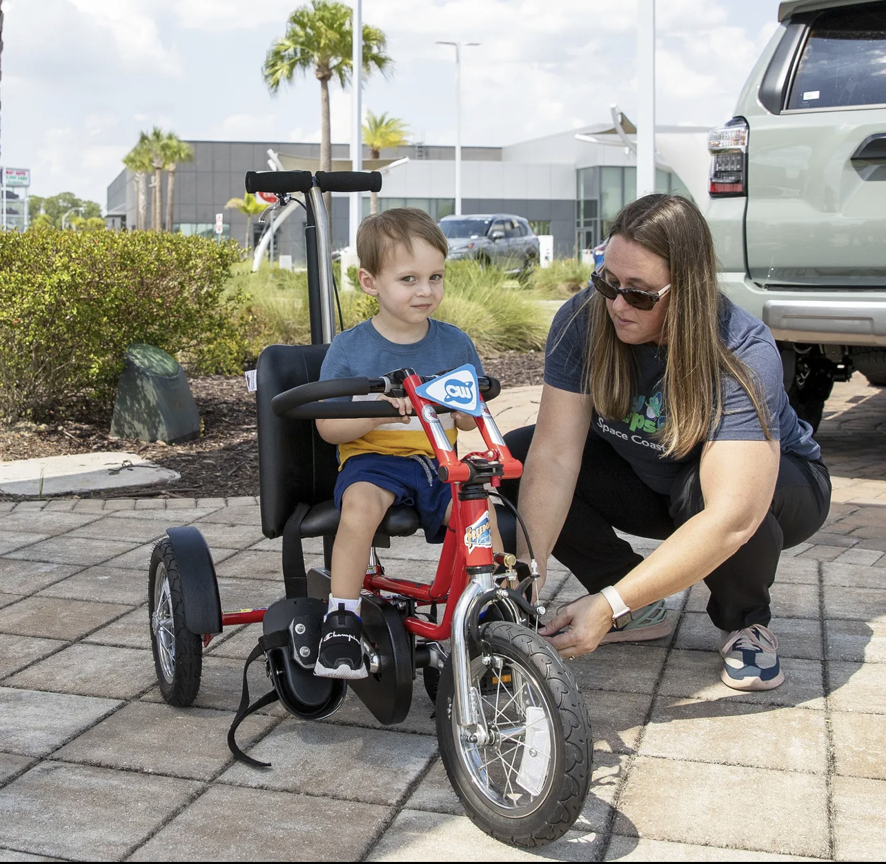 VARIETY DONATES MOBILITY BIKE, MULTIPLE TODDLER CARS & SENSORY TOYS TO ...